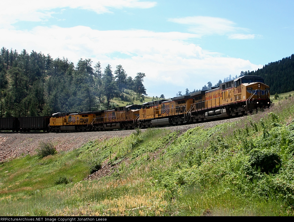 UP 6728 leads a quartet of AC4400's up the hill with a train of empties